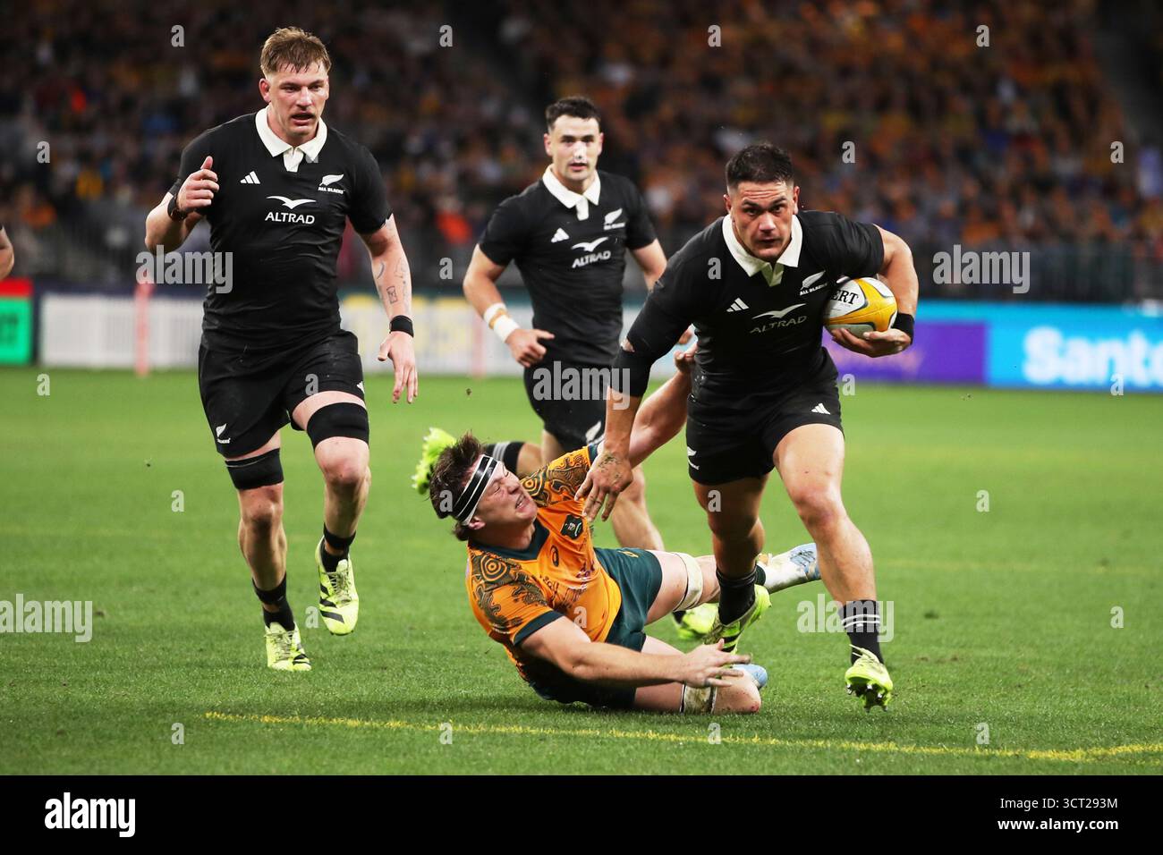 New Zealand's Quinn Tupaea fends off Australia's Tom Hooper to score a ...