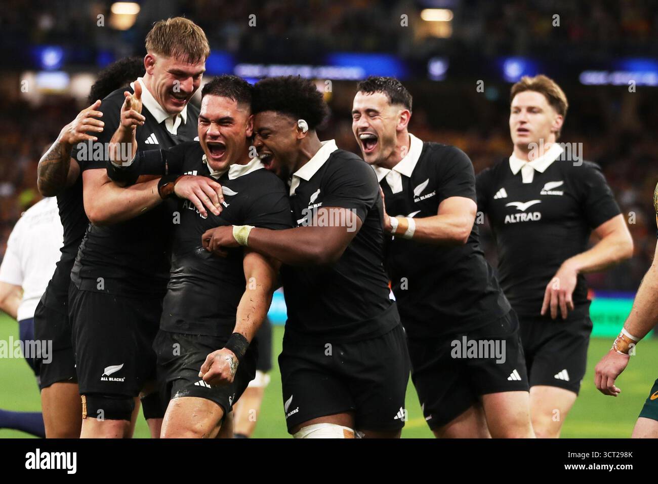 New Zealand's Quinn Tupaea, second left, is congratulated by teammates ...