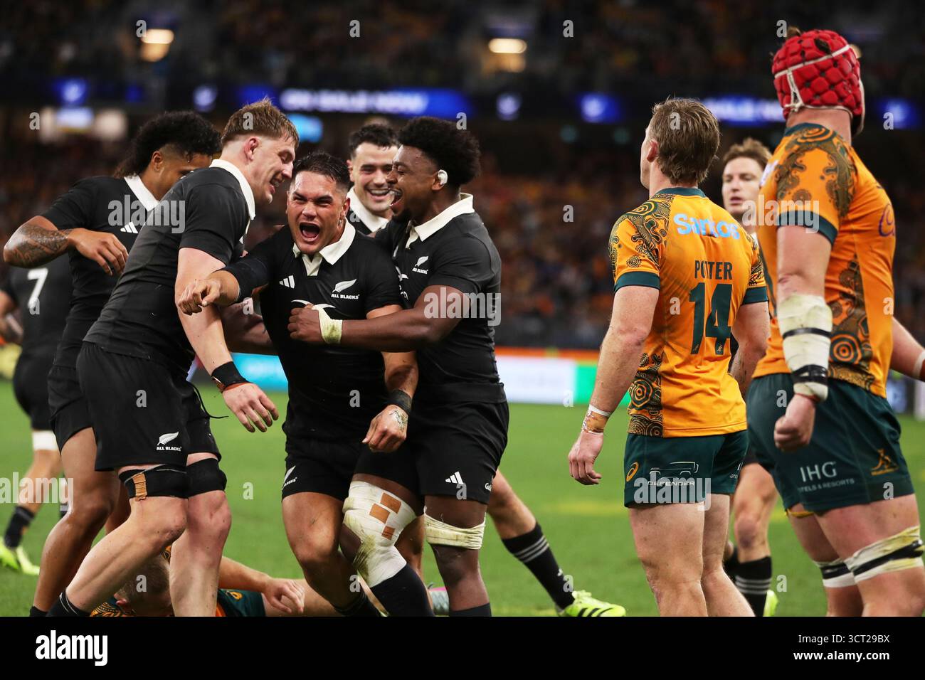 New Zealand's Quinn Tupaea, third left, is congratulated by teammates ...