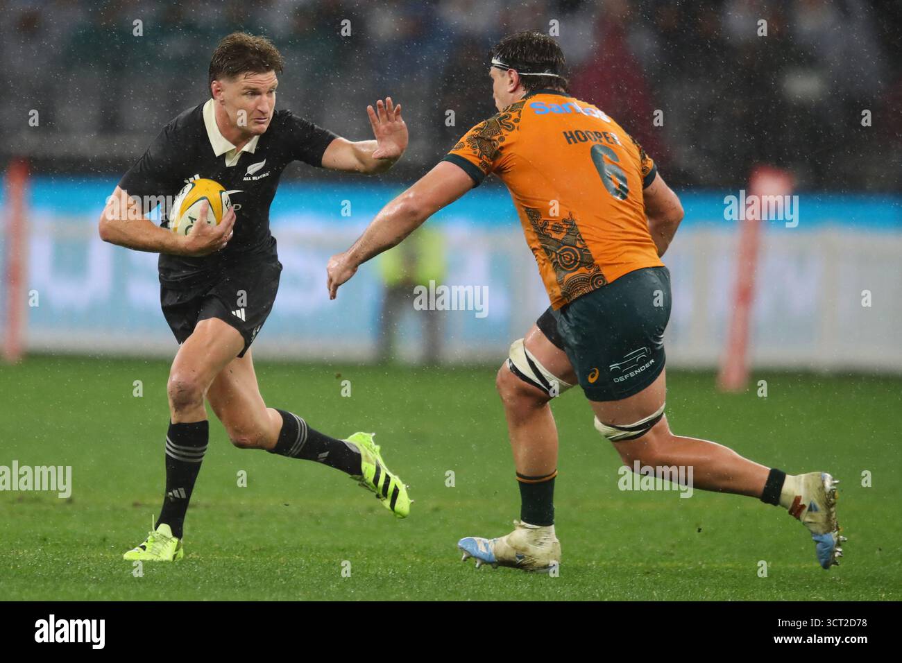New Zealand's Jordie Barrett attempts to run past Australia's Tom ...