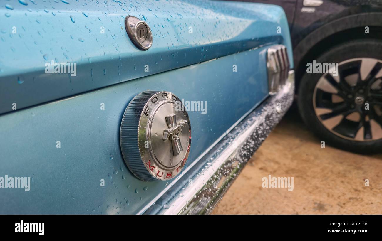 A blue vintage Ford Mustang A blue vintage Ford Mustang parked outside ...