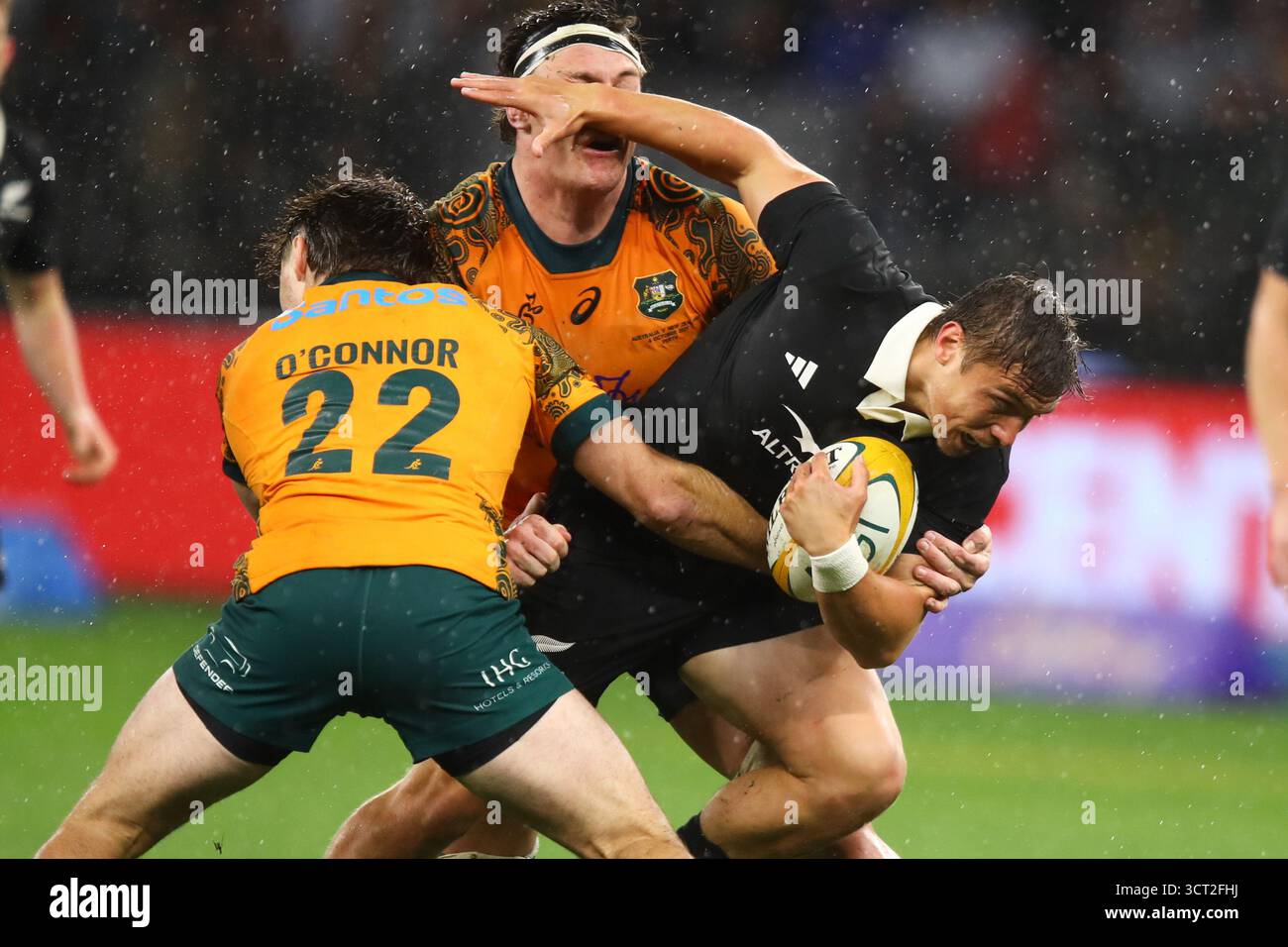 New Zealand's Cortez Ratima, right, is tackled by Australia's James O ...