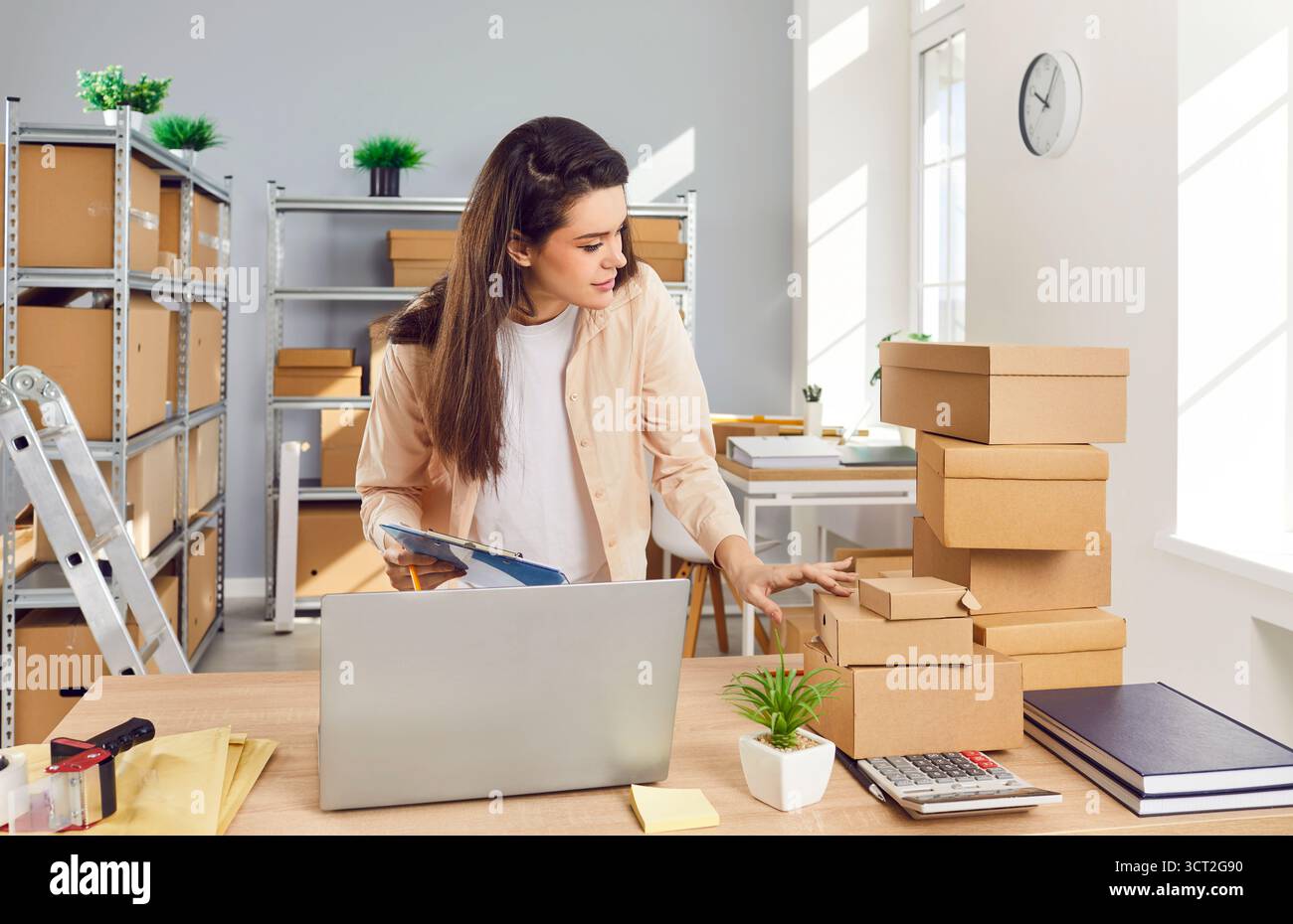 Female entrepreneur conducting inventory hi-res stock photography and ...