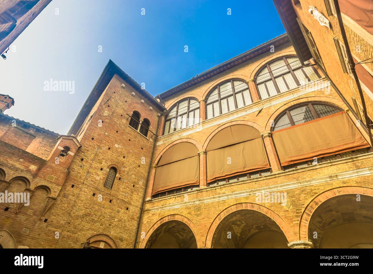 Photo of a typical building facade in Siena old town showing medieval ...