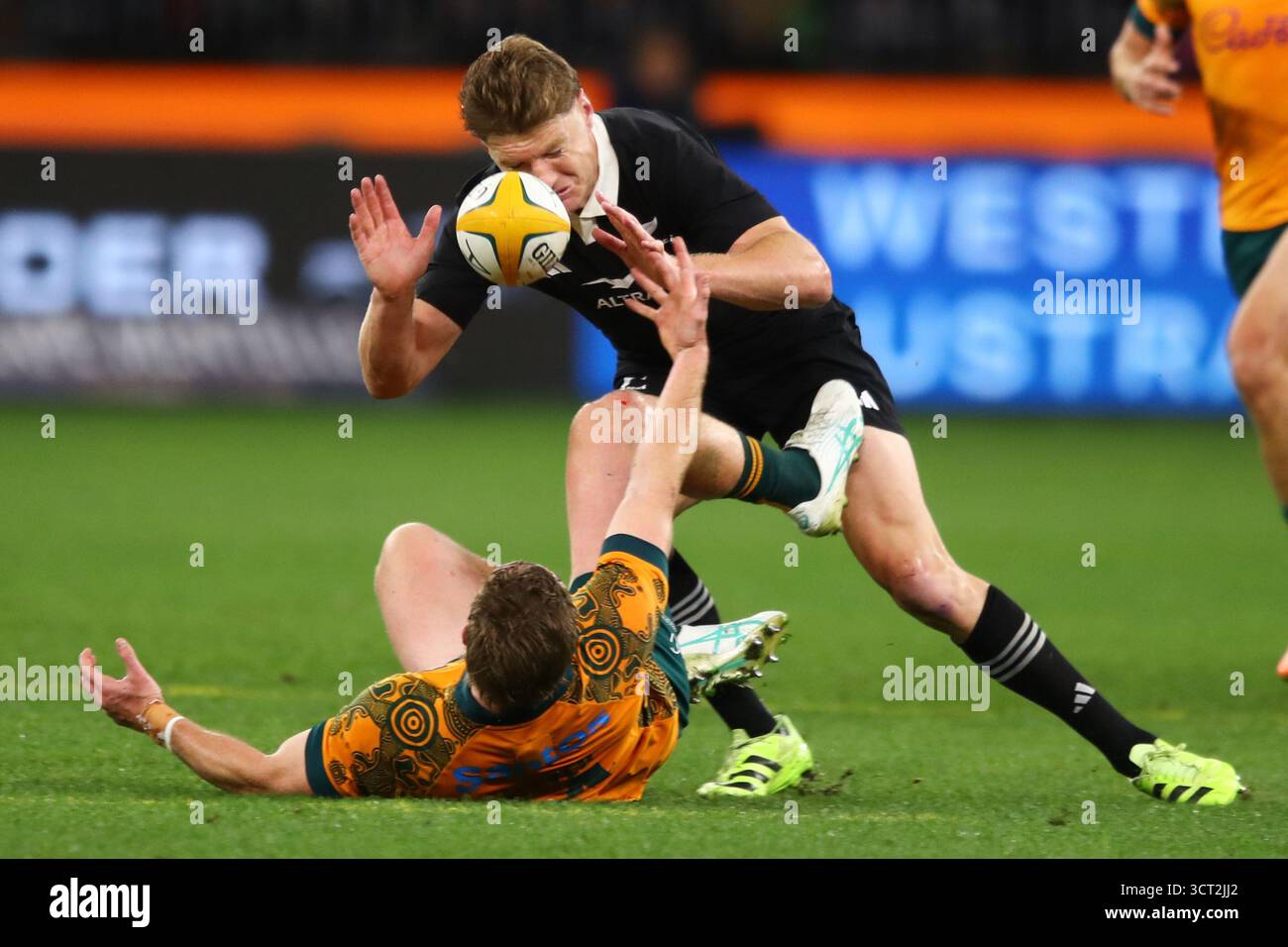 New Zealand's Jordie Barrett reacts as he competes for the ball with ...