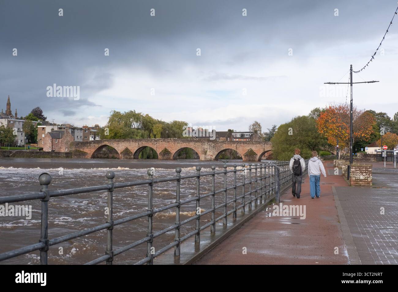 4th October 2025, Dumfries, Scotland, two people walk alongside the ...