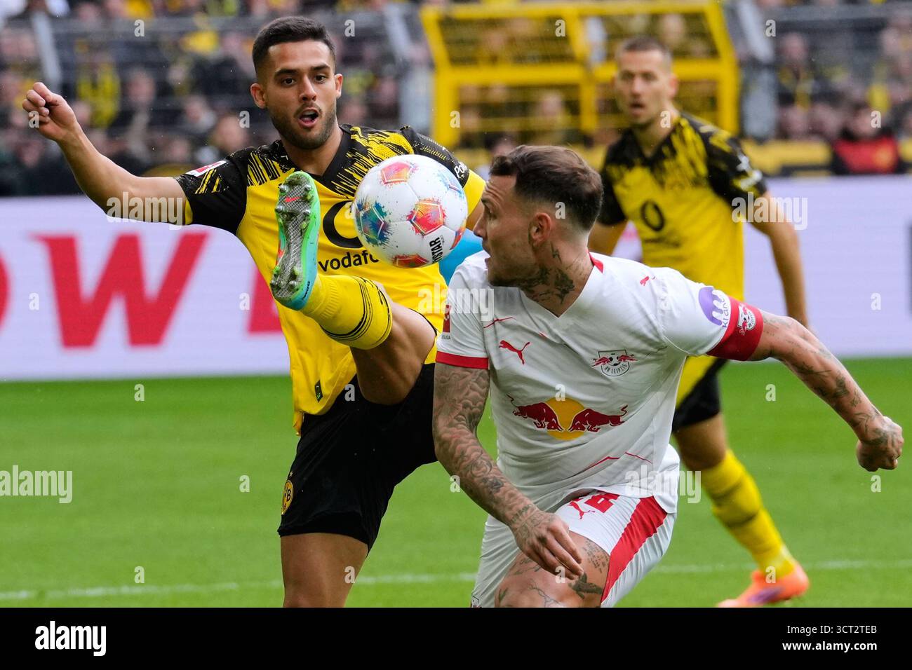 Dortmund's Yan Couto, left, and Leipzig's David Raum challenge for the ...