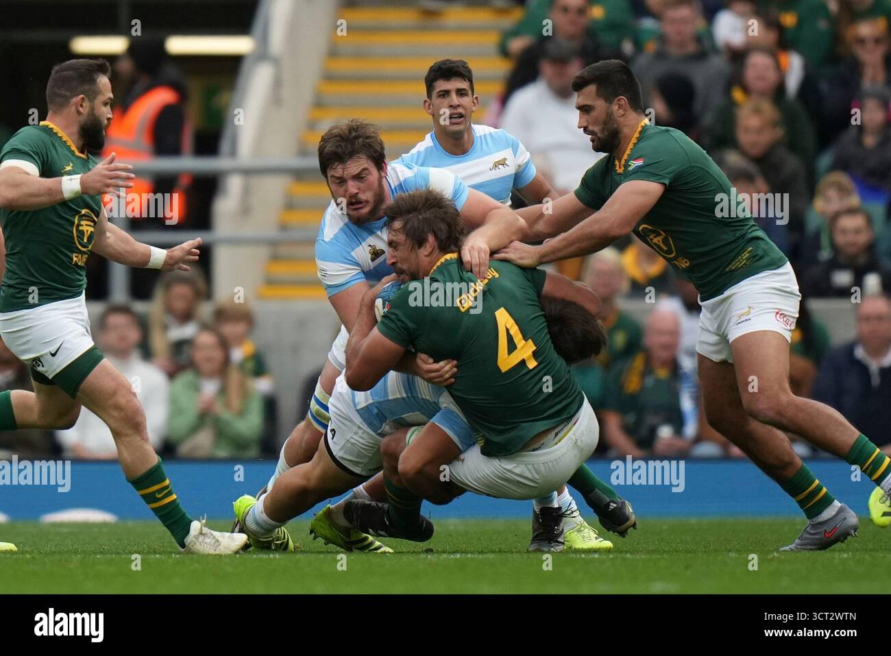 Argentina's Pedro Rubiolo, center, tackles South Africa's Eben Etzebeth ...