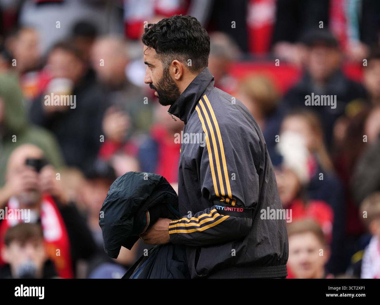 Manchester United manager Ruben Amorim wearing a black armband as a ...