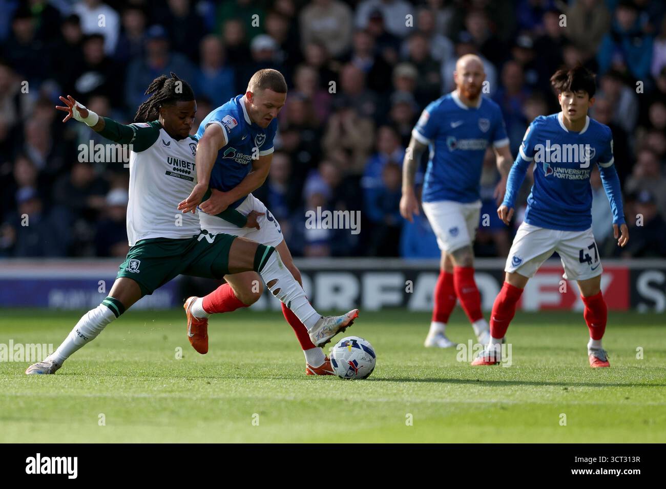 Middlesbrough's Sontje Hansen battles for the ball with Portsmouth's ...
