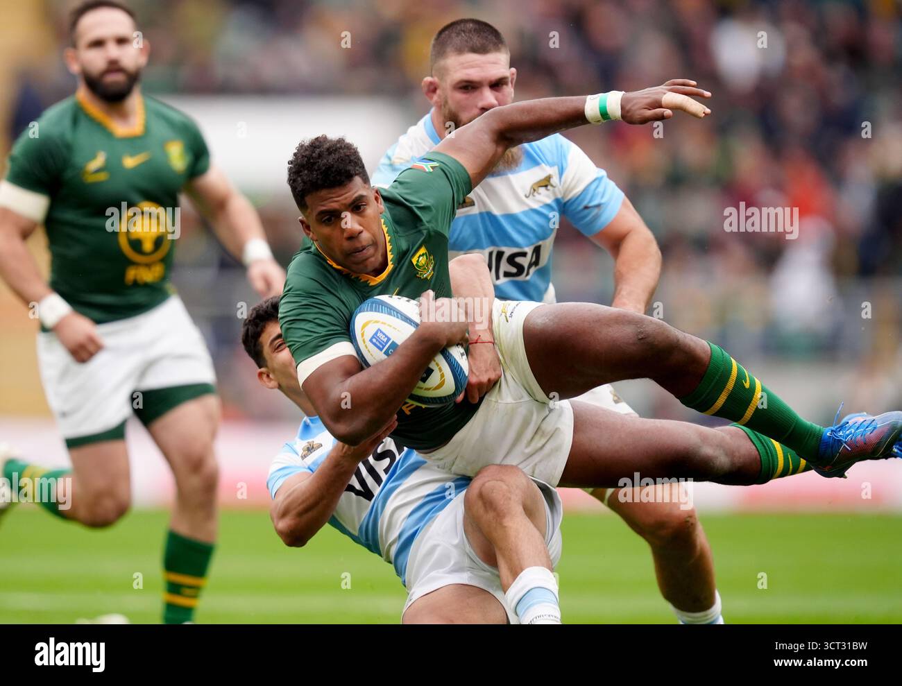 South Africa's Canan Moodie (front) is tackled by Argentina's Simon ...