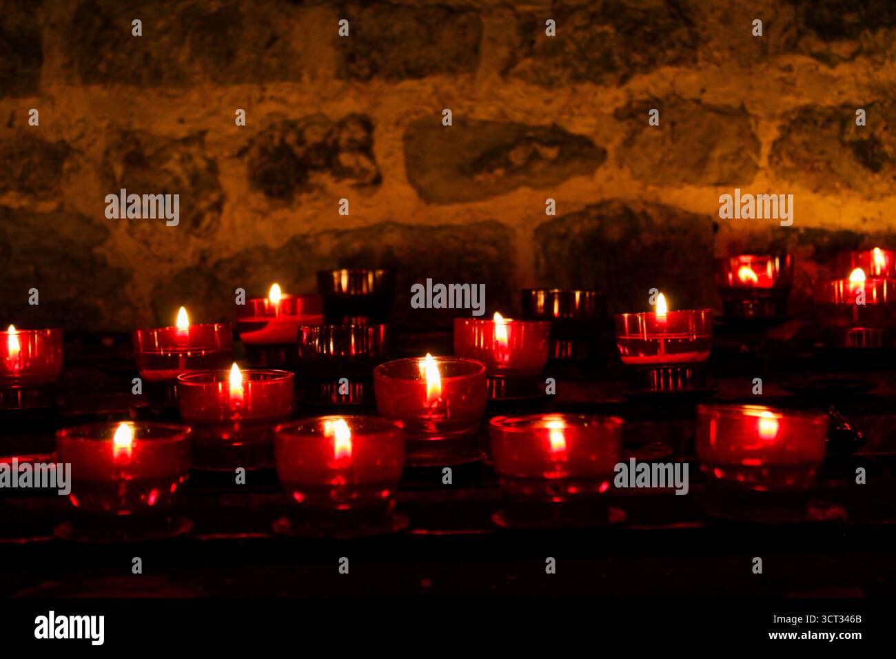 Multiple red votive candles hi-res stock photography and images - Alamy