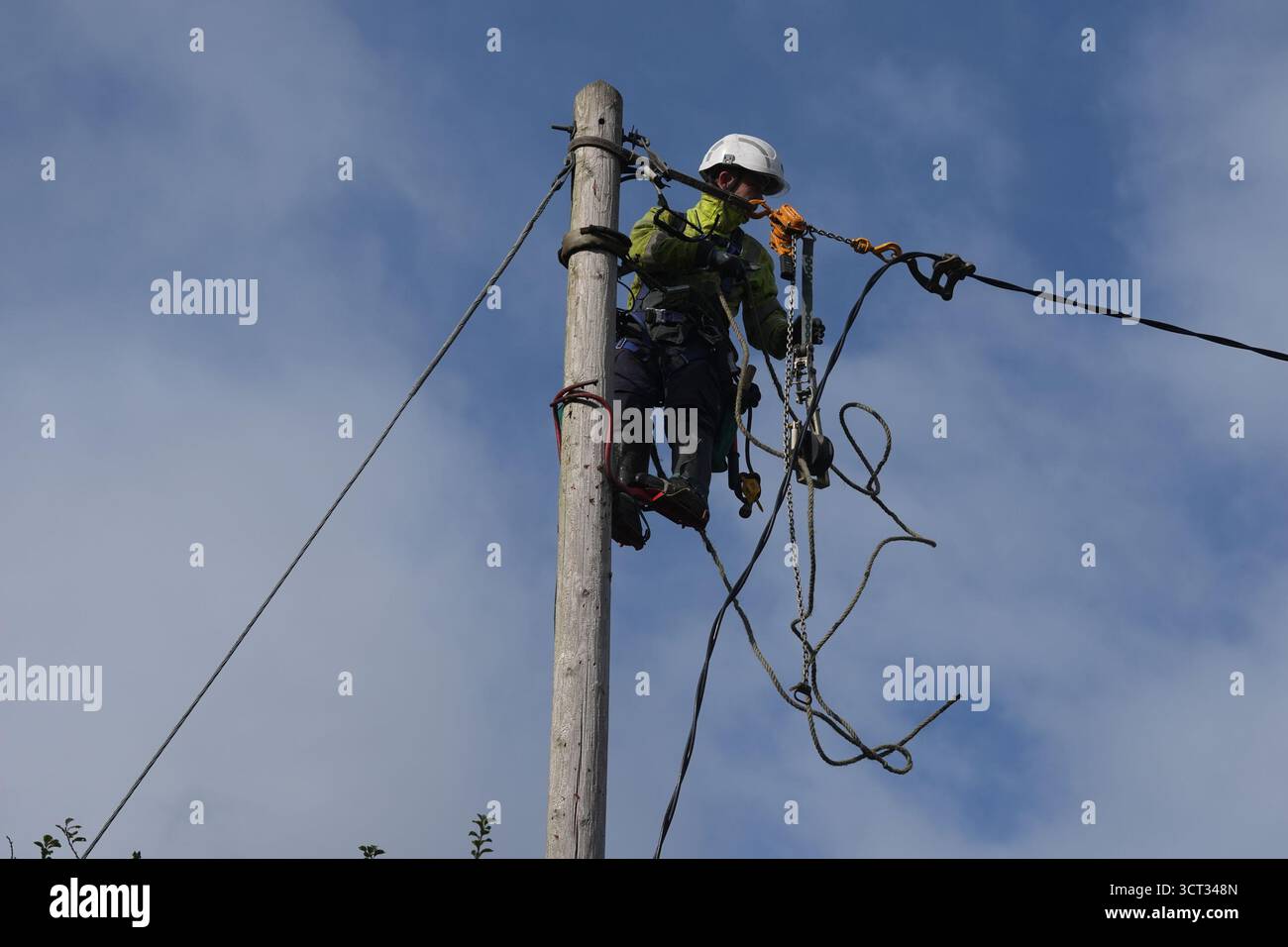 Electricity Supply Board (ESB) network technician Mark Lennon carries ...