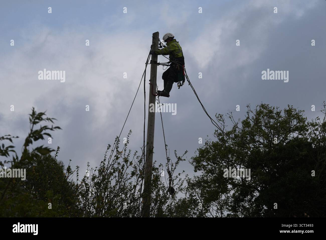Electricity Supply Board (ESB) network technician Mark Lennon carries ...