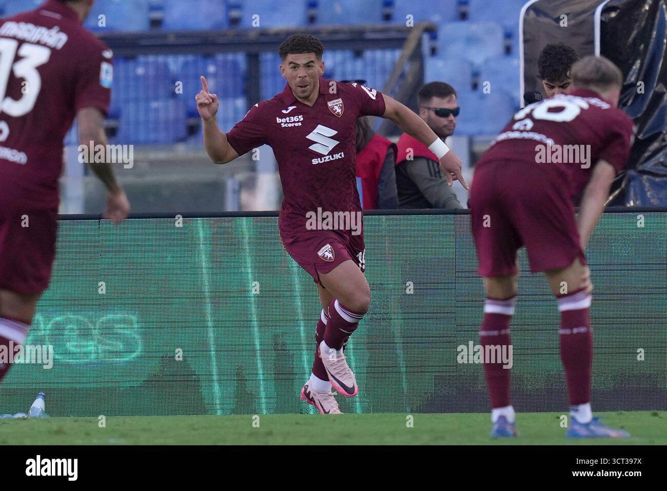 Torino's Che Adams, center, celebrates scoring his sides' second goal ...