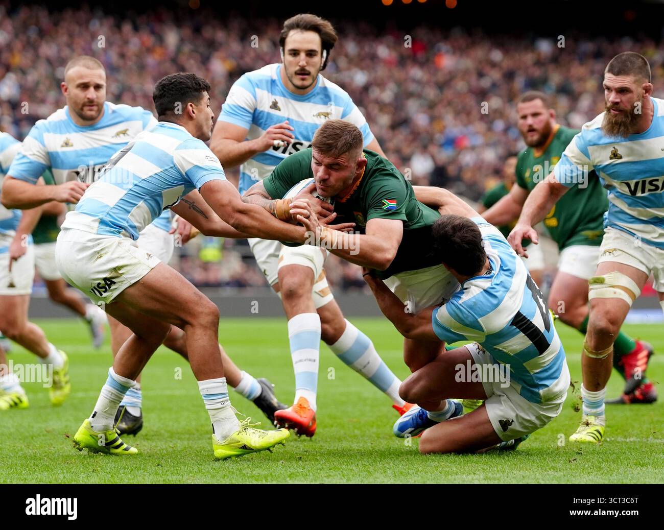 South Africa's Malcolm Marx (centre) is tackled by Argentina's Simon ...