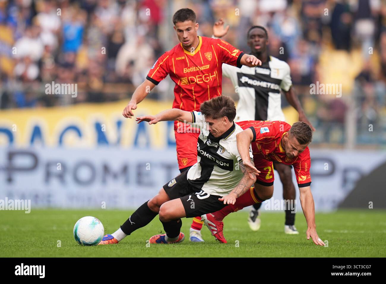 Parma's Adrian Bernabe fights for the ball with Lecce's Ylber Ramadani ...