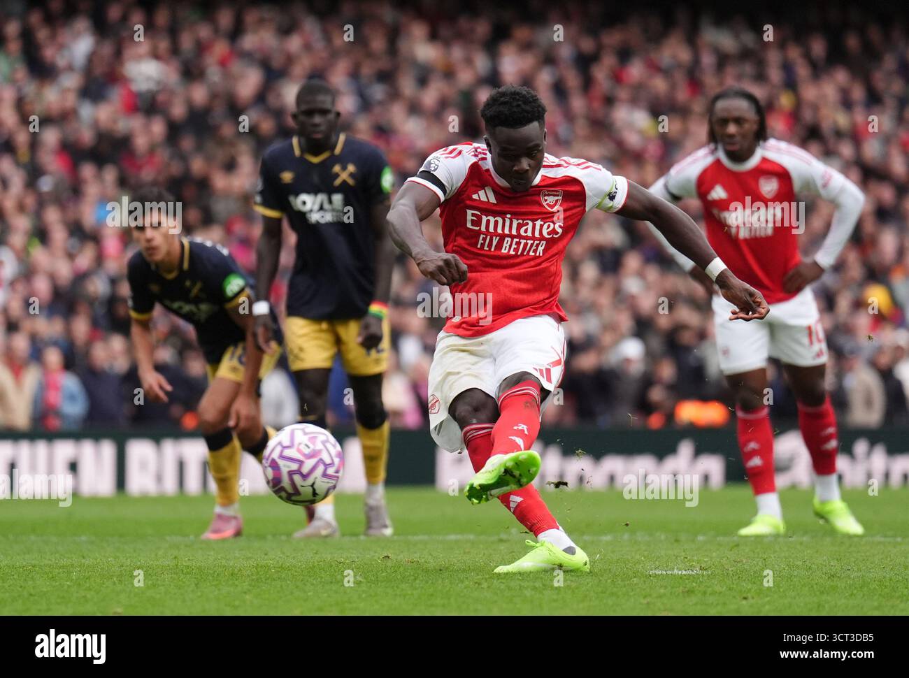 Arsenal's Bukayo Saka scores their side's second goal of the game from ...
