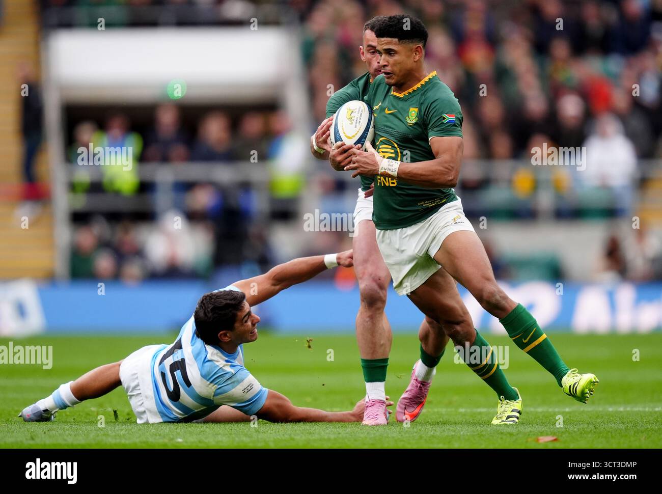 South Africa's Sacha Mngomezulu (right) skips away from a tackle from ...