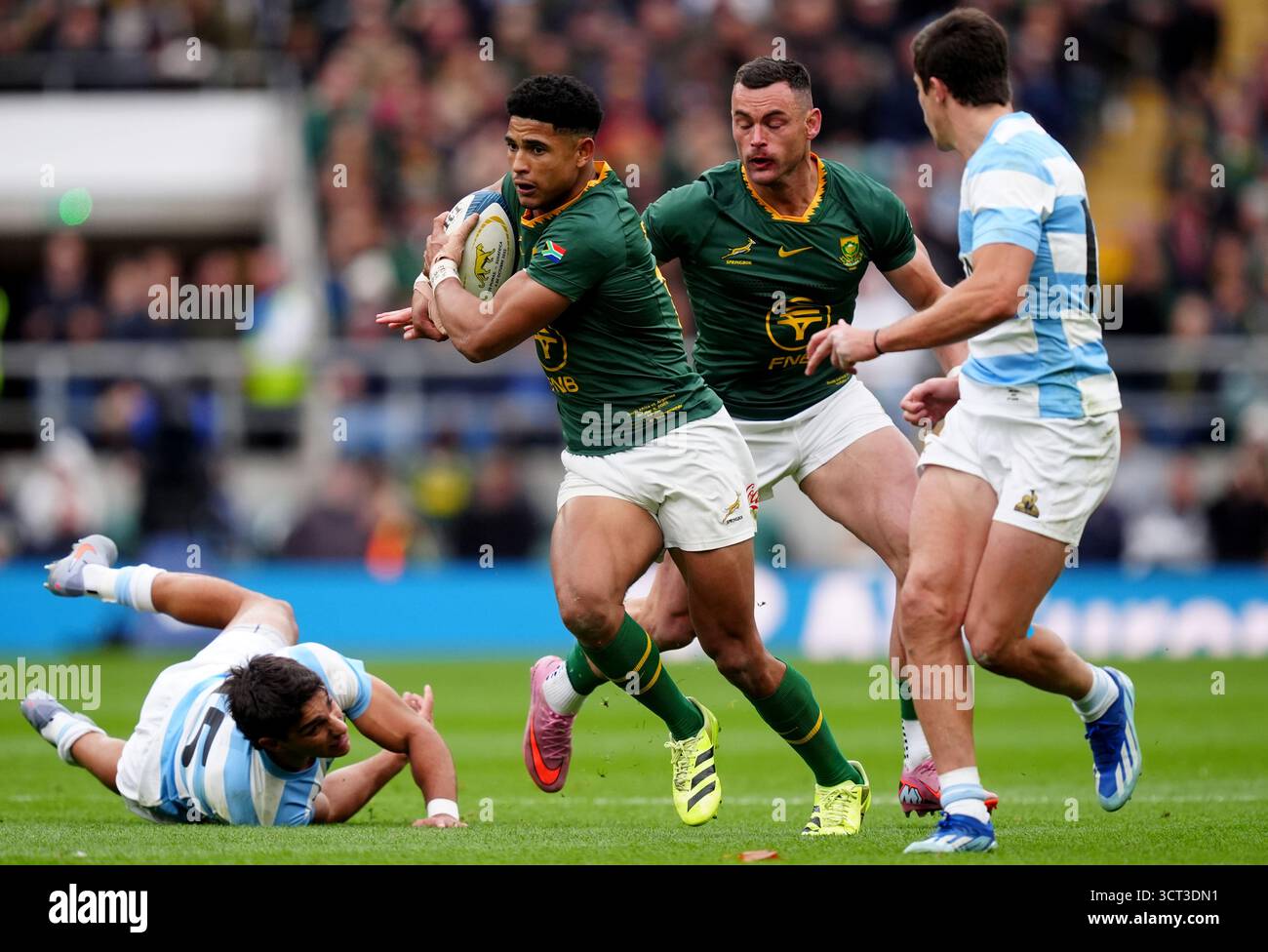 South Africa's Sacha Mngomezulu (second left) skips away from a tackle ...