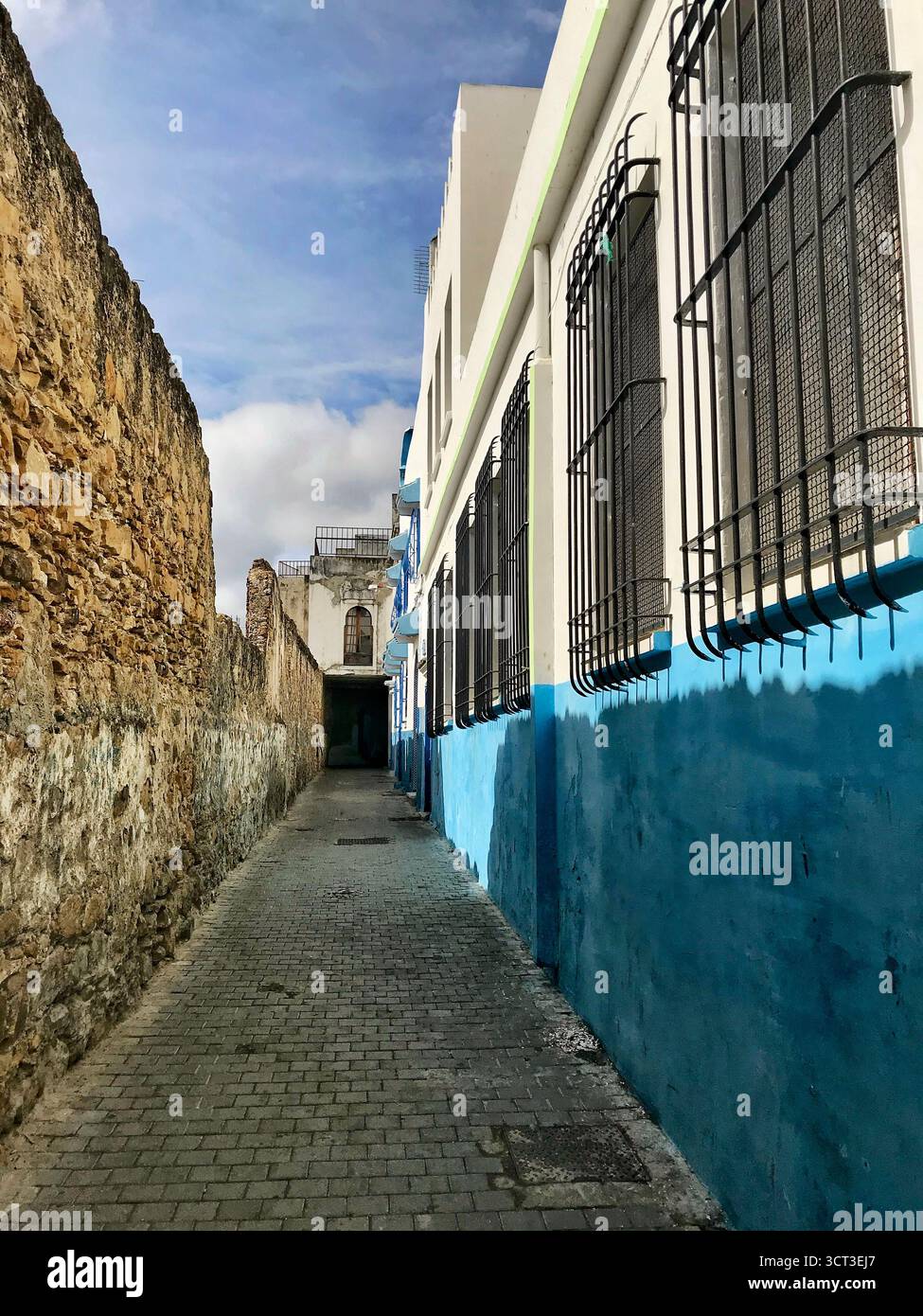 Narrow alley in the Old Medina Kasbah of Tangier, Morocco, with aged ...
