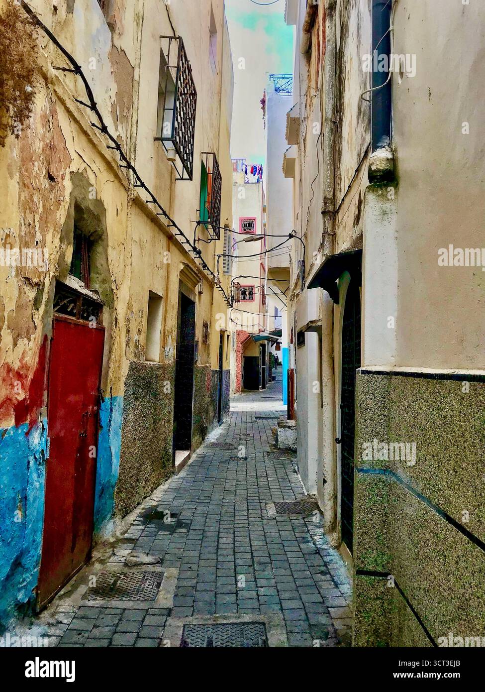 Narrow alley in the Old Medina Kasbah of Tangier, Morocco, with aged ...