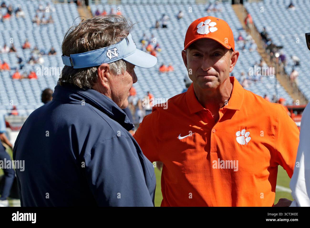 North Carolina head coach Bill Belichick, left, and Clemson head coach ...