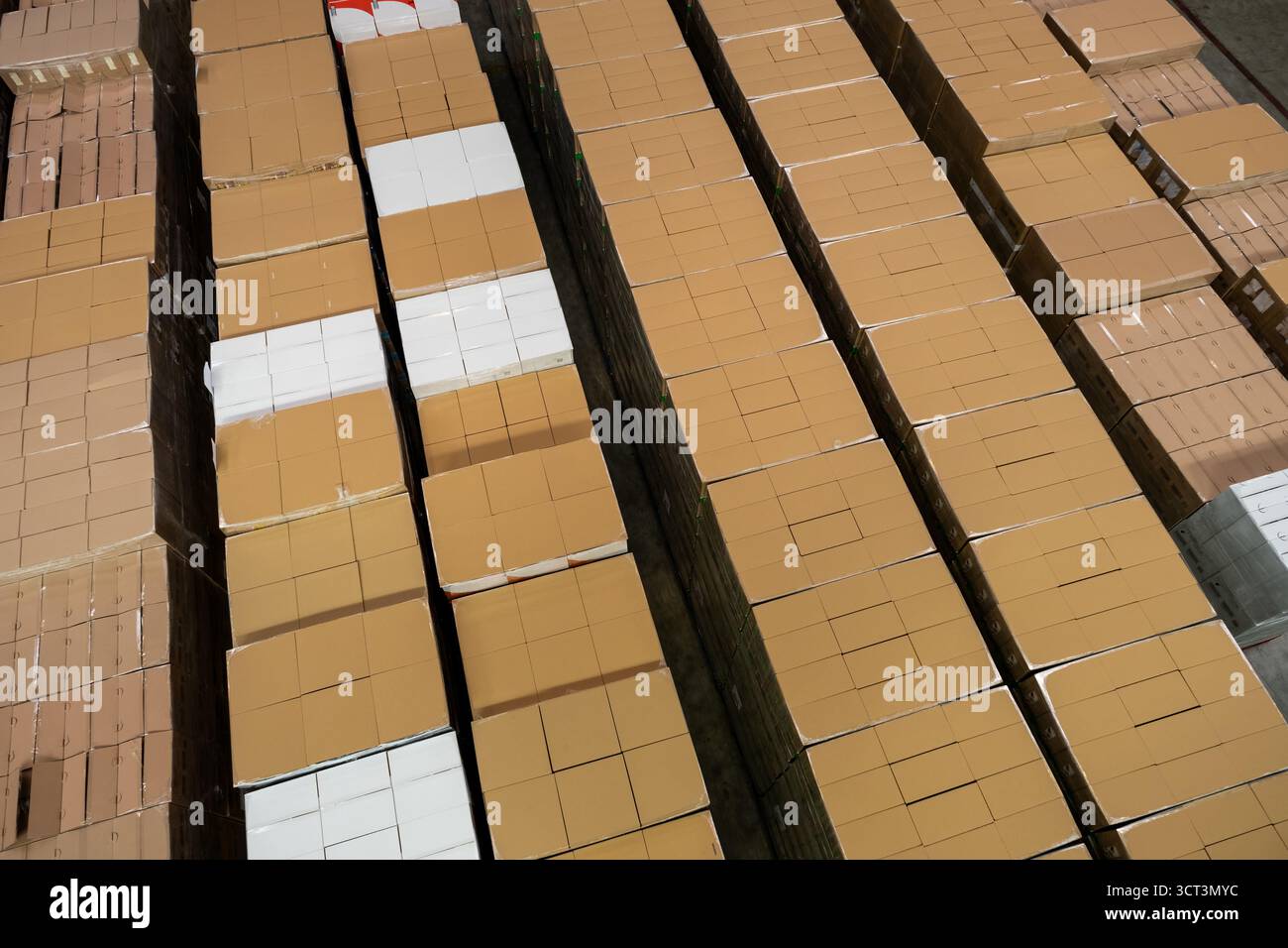 Cartons in a storage warehouse Stock Photo - Alamy