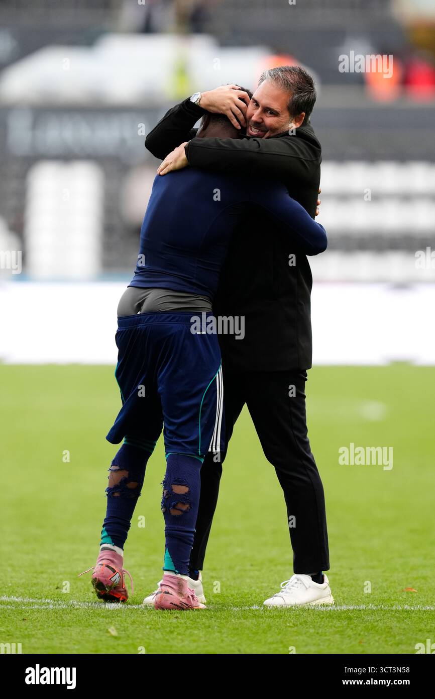 Leicester City manager Marti Cifuentes (right) hugging Abdul Fatawu ...