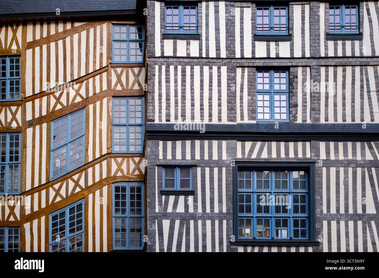 A facade of a typical Normandy building with half-timbered buildings ...