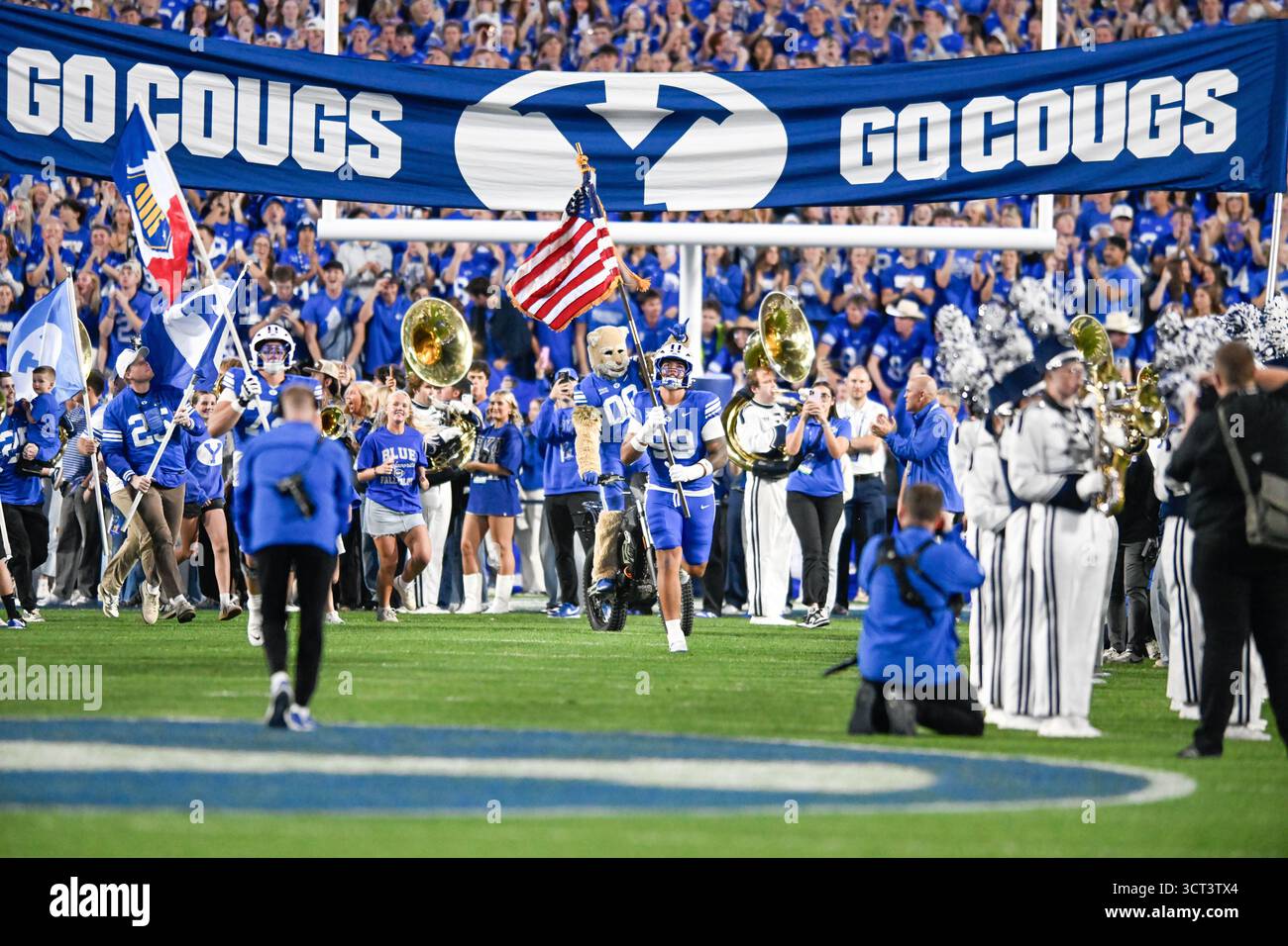 PROVO, UT - OCTOBER 03: The BYU football team enters the stadium with ...