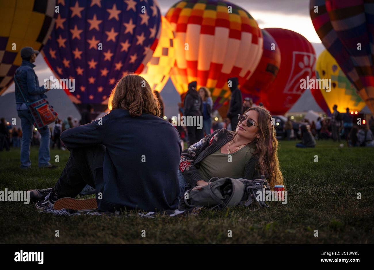 Luke Bruce and Shelly Ortiz, of Denver watch balloons inflate during ...
