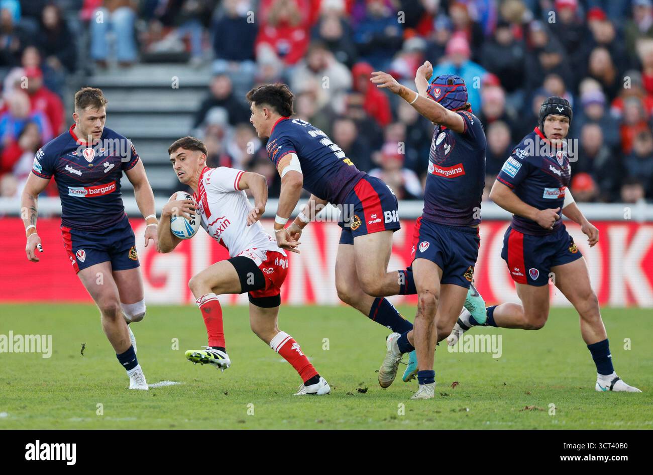 Hull KR's Arthur Mourgue takes on the St Helens defenceduring the Grand ...