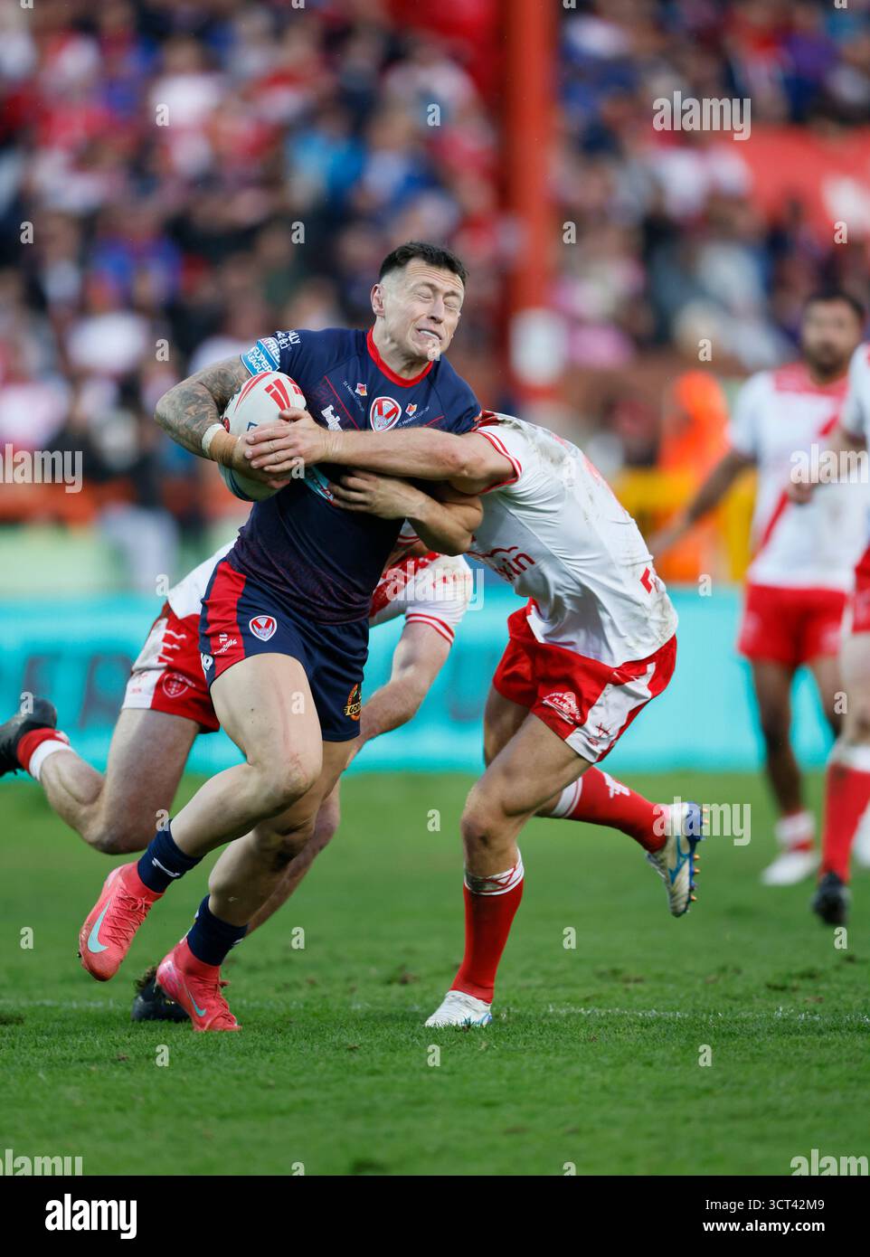 St Helens Deon Cross is tackled during the Grand Final Semi Final match ...