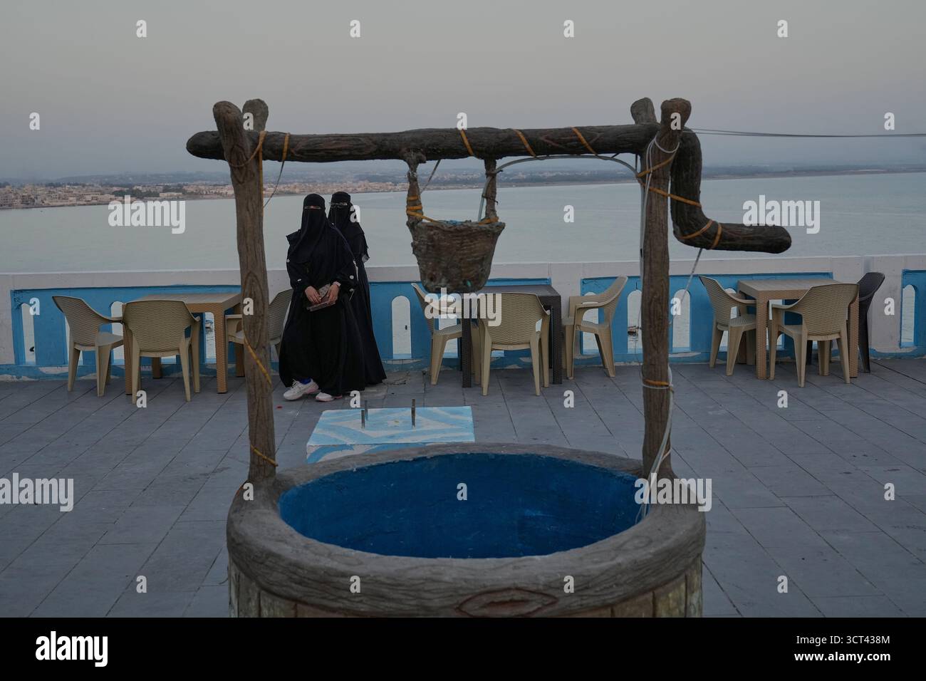 Veiled Syrian women walk on Latakia's Mediterranean seaside corniche ...