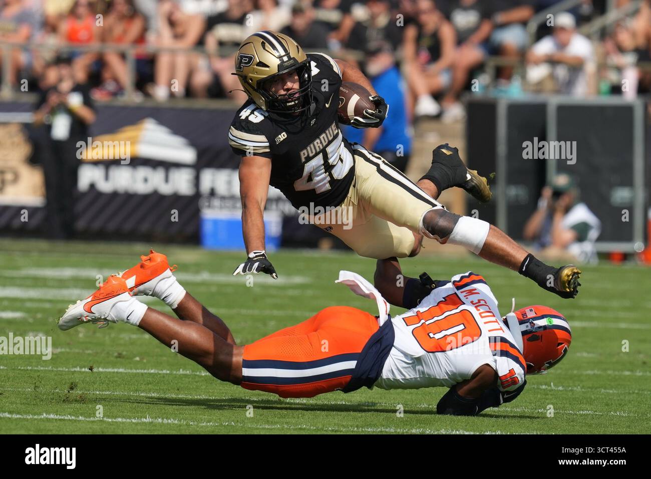 Purdue running back Devin Mockobee (45) is tackled by Illinois ...