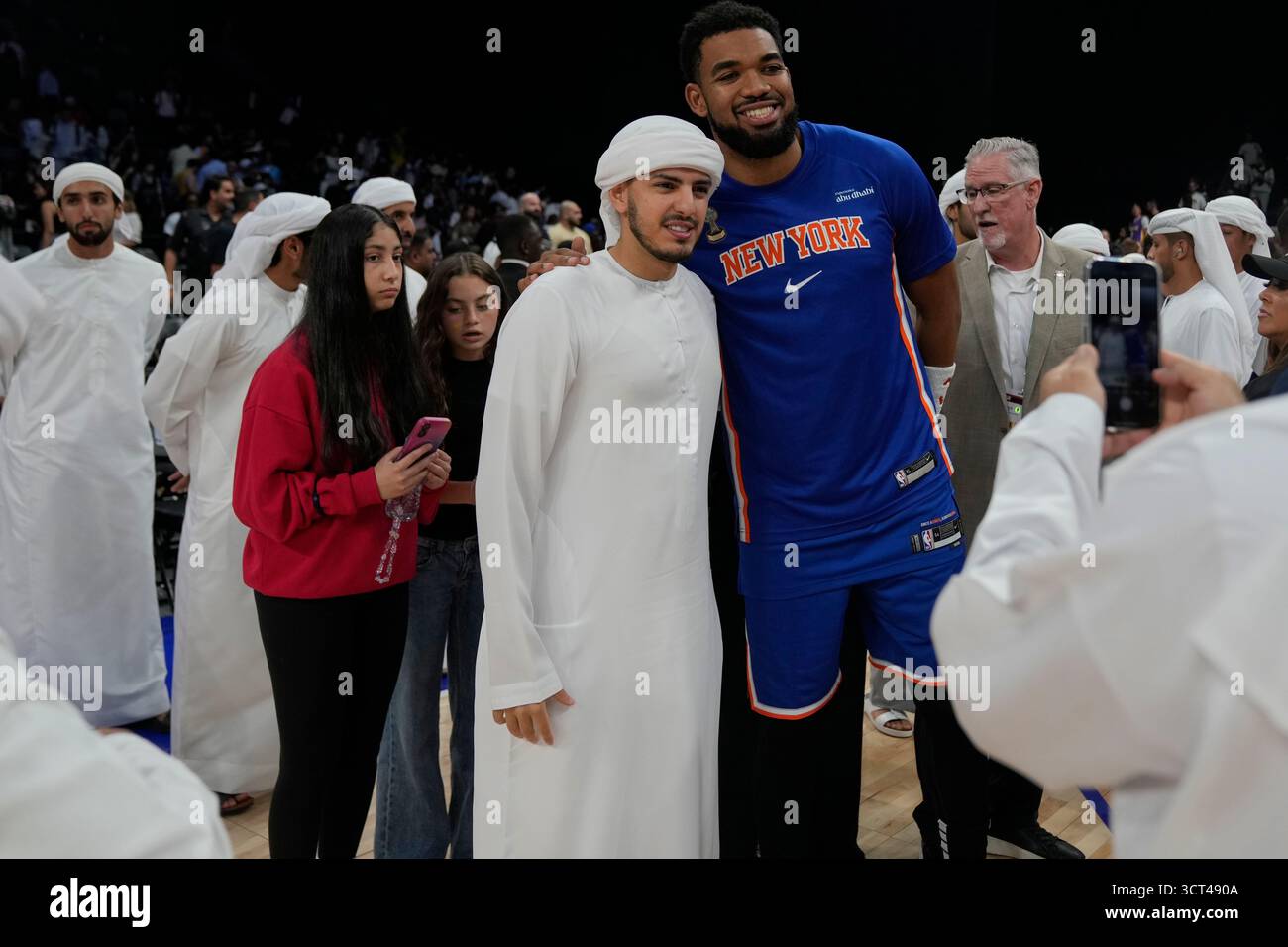 Fans take pictures with New York Knicks center Karl-Anthony Towns after ...