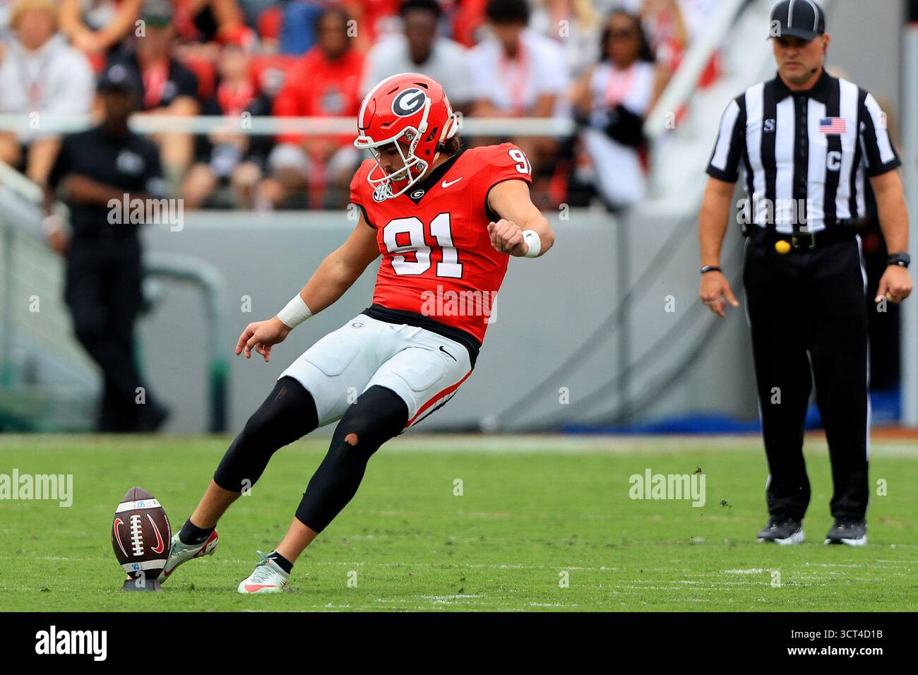 ATHENS, GA - OCTOBER 04: Peyton Woodring kicks off during the Saturday ...