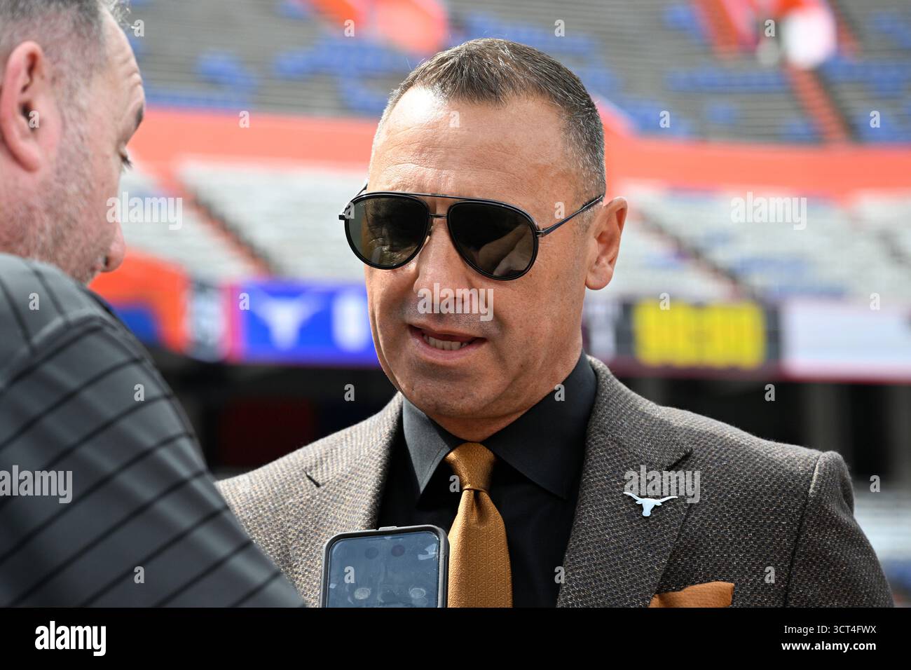 Texas head coach Steve Sarkisian, right, is interviewed on the field ...