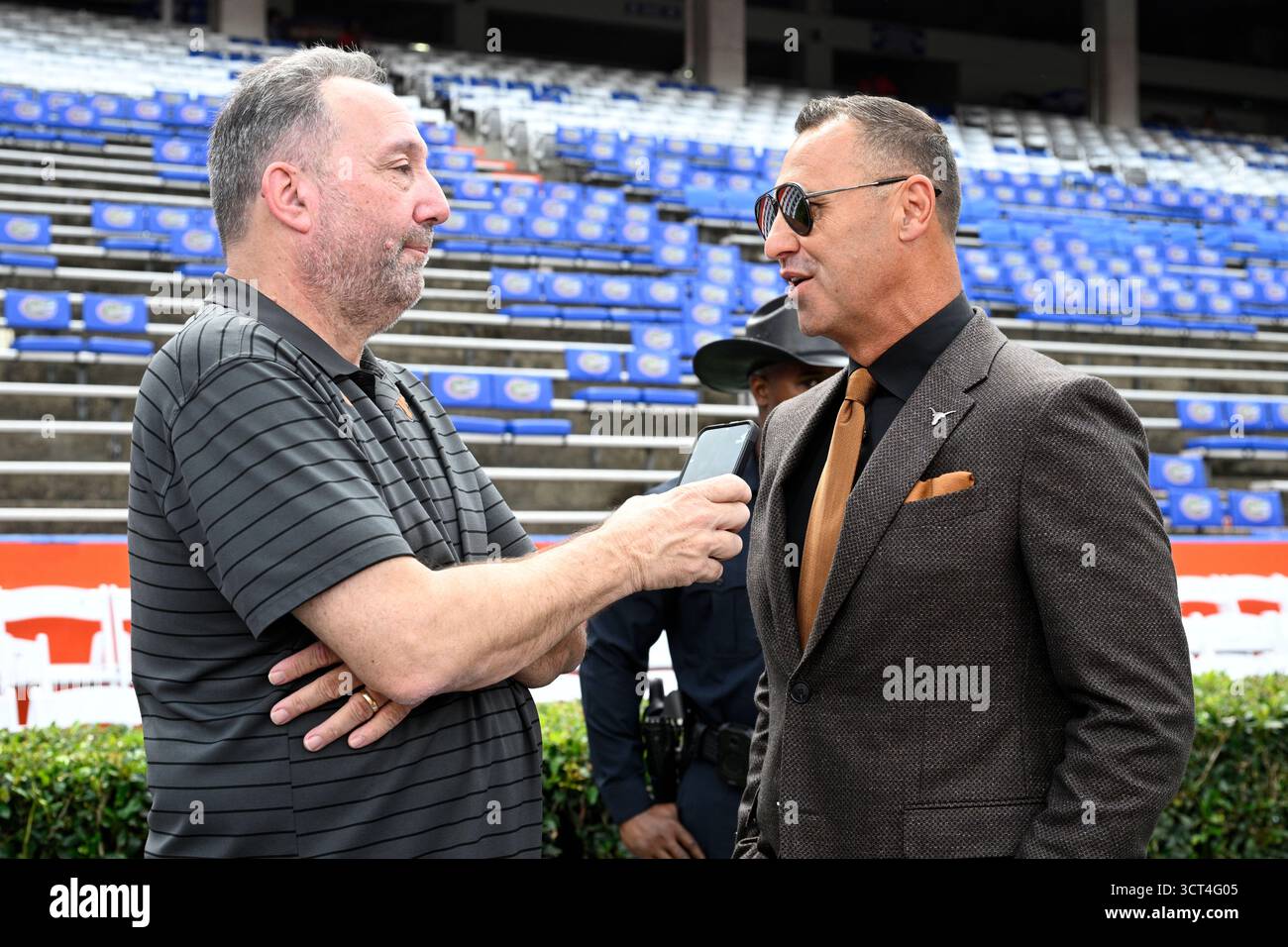 Texas head coach Steve Sarkisian, right, is interviewed on the field ...