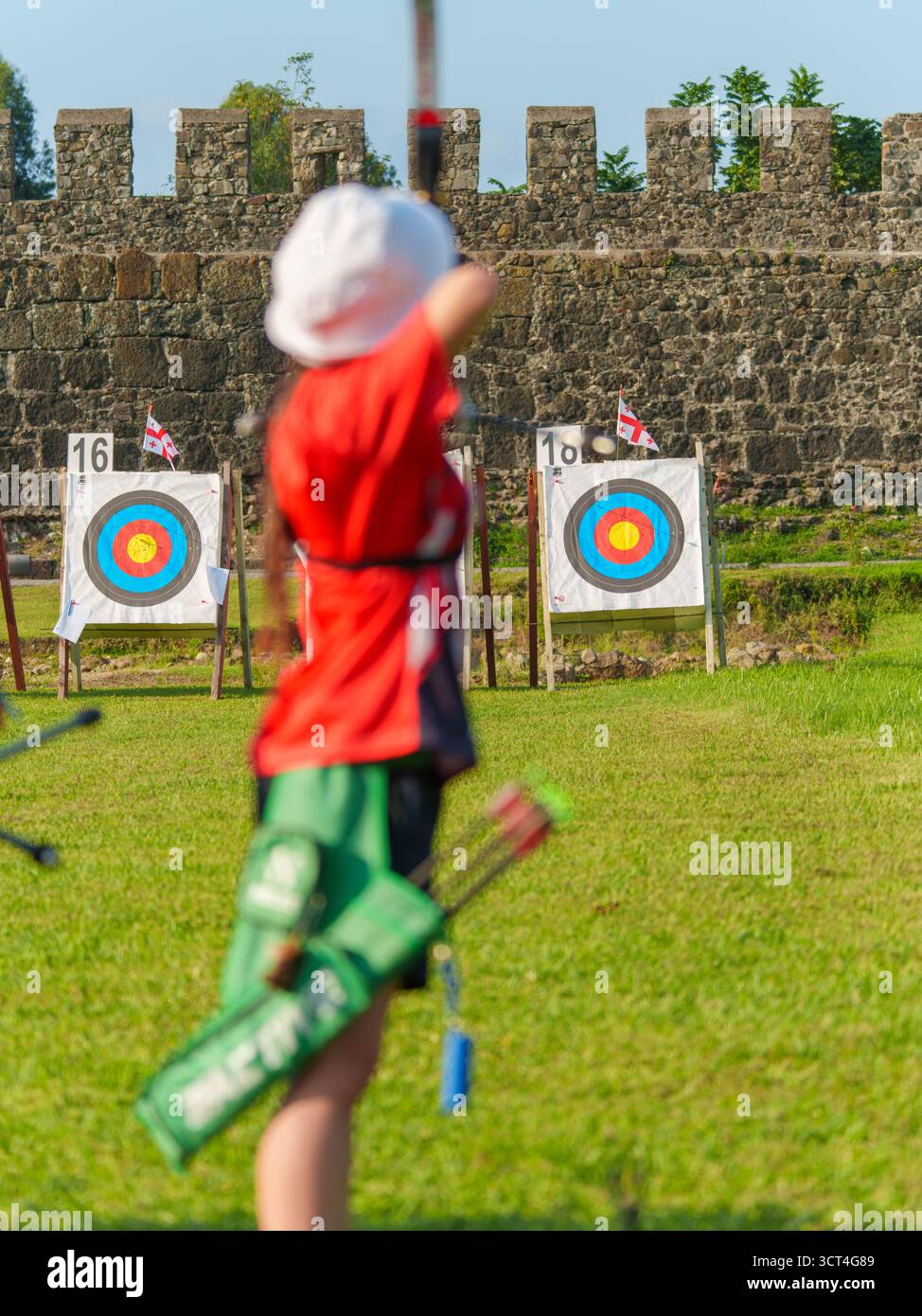 Young Archer Aiming Recurve Bow at Outdoor Event Stock Photo - Alamy