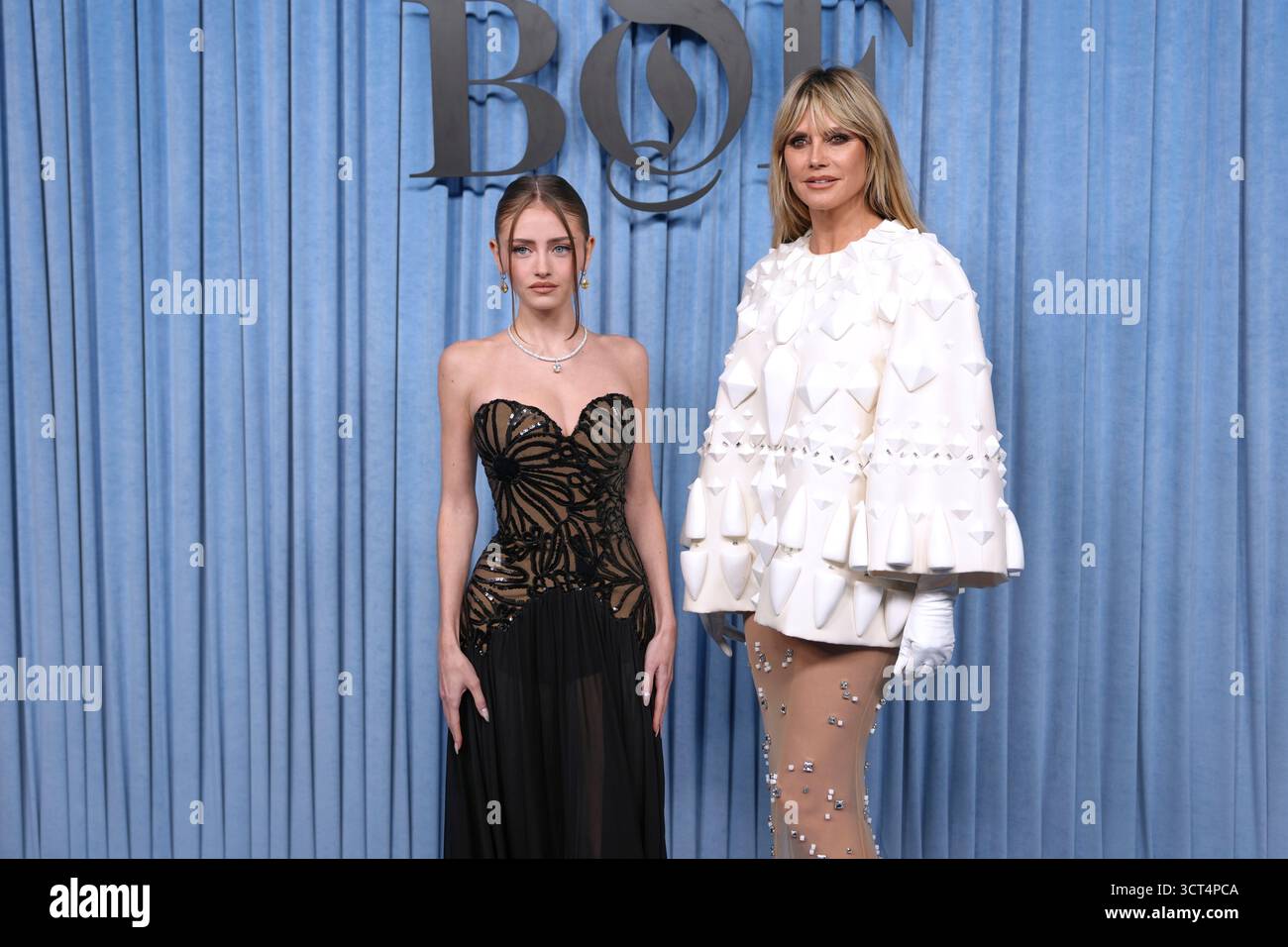 Leni Olumi Klum, left, and Heidi Klum pose for photographers upon ...
