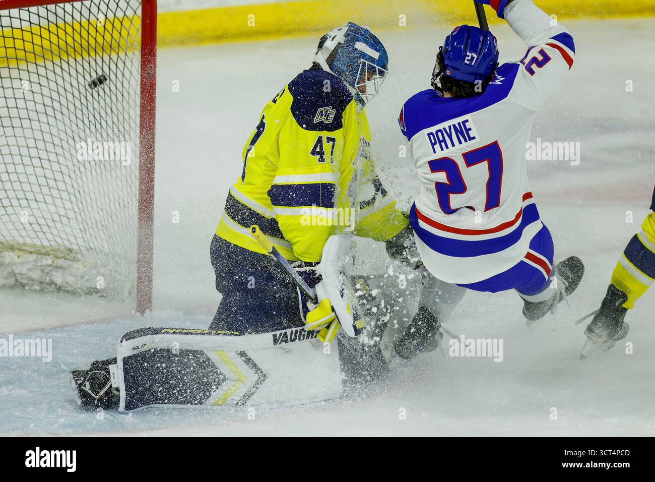 Merrimack goalie Max Lundgren (47) deflects a shot of Umass Lowell ...