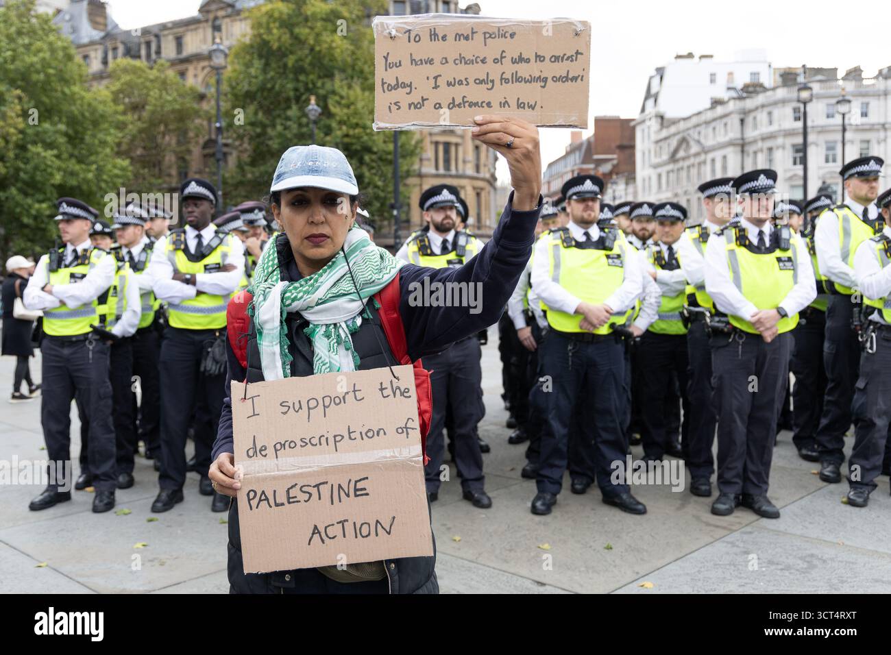 London, UK. 04th Oct, 2025. A protester holds placards during a Lift ...