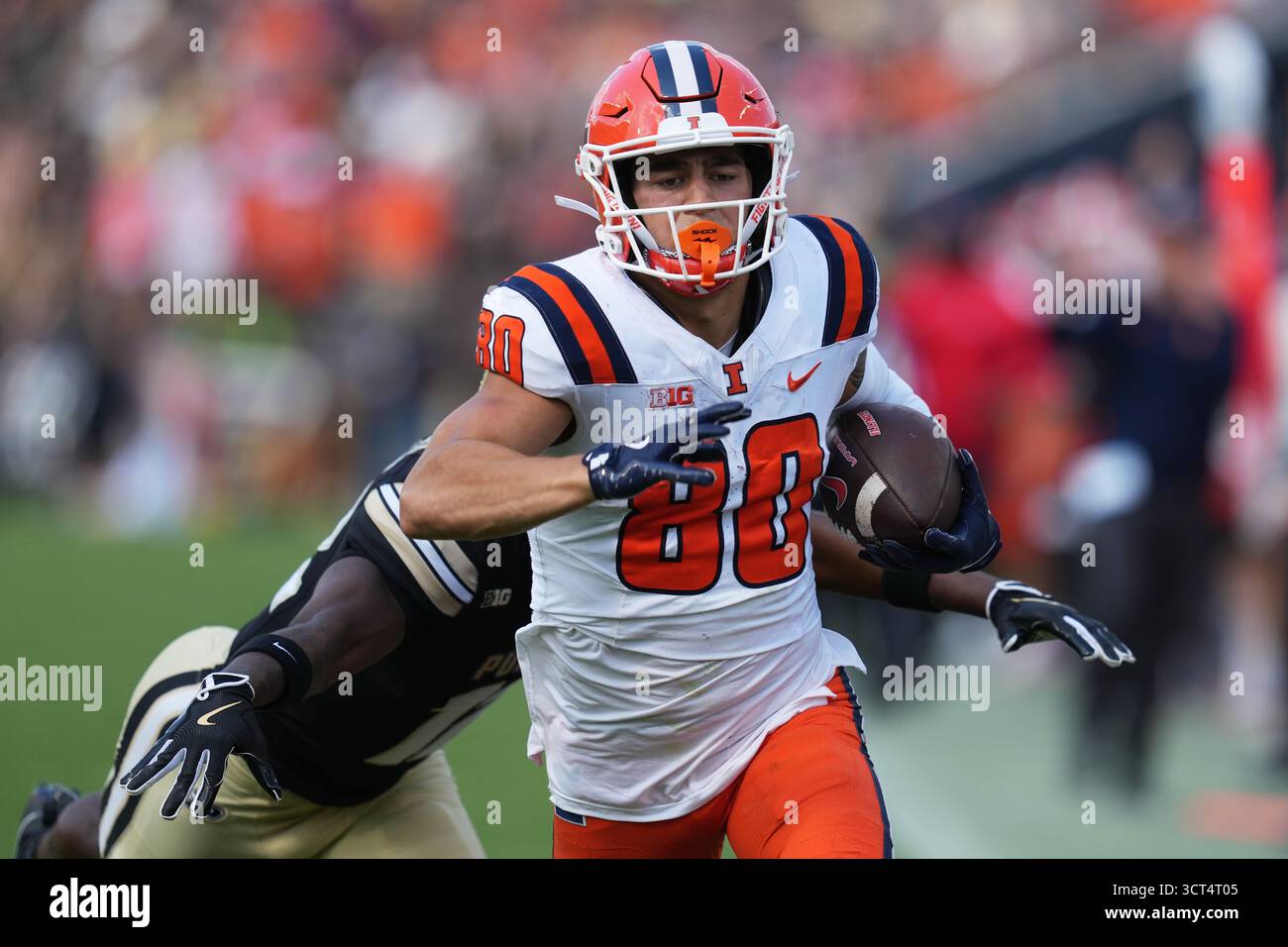 Illinois wide receiver Hank Beatty (80) is tackled by Purdue defensive ...