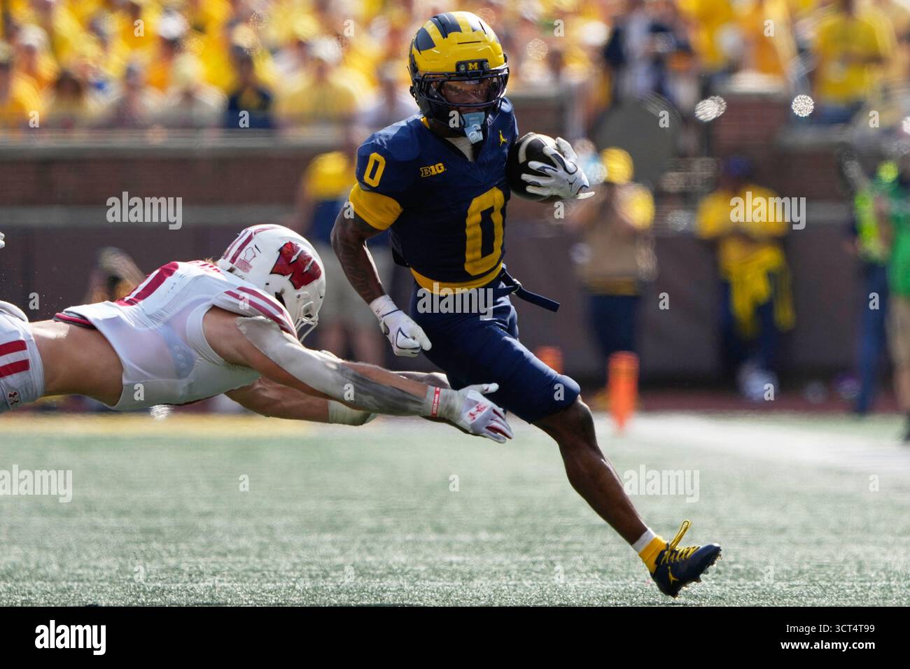 Michigan wide receiver Semaj Morgan, right, runs against Wisconsin ...