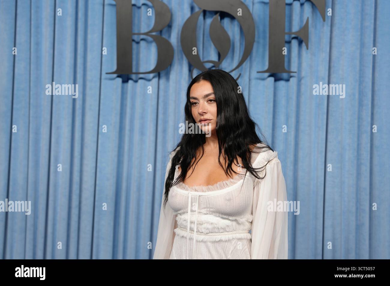 Charli XCX poses for photographers upon arrival at the BoF 500 gala in ...
