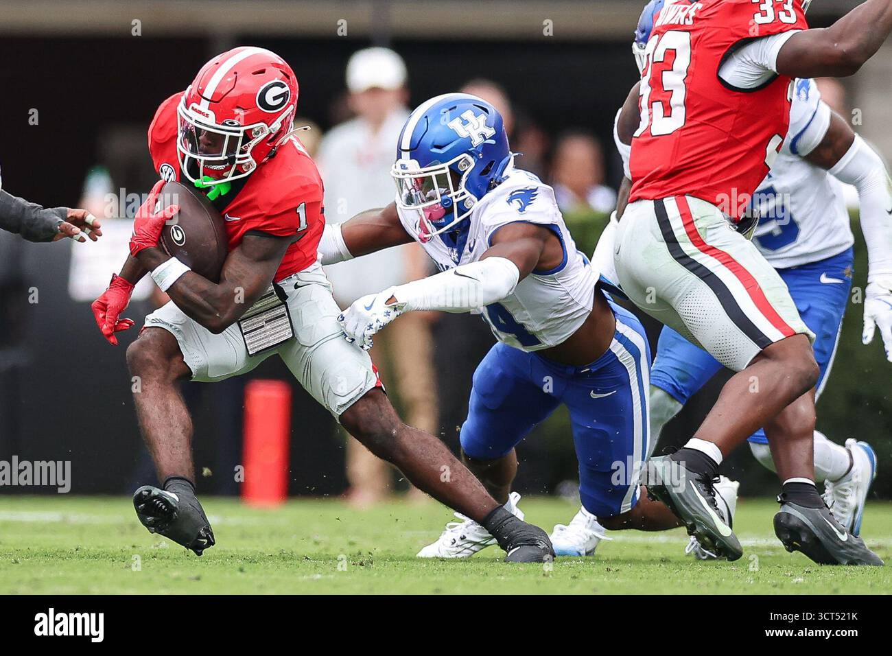 Georgia wide receiver Zachariah Branch, left, runs with the football ...