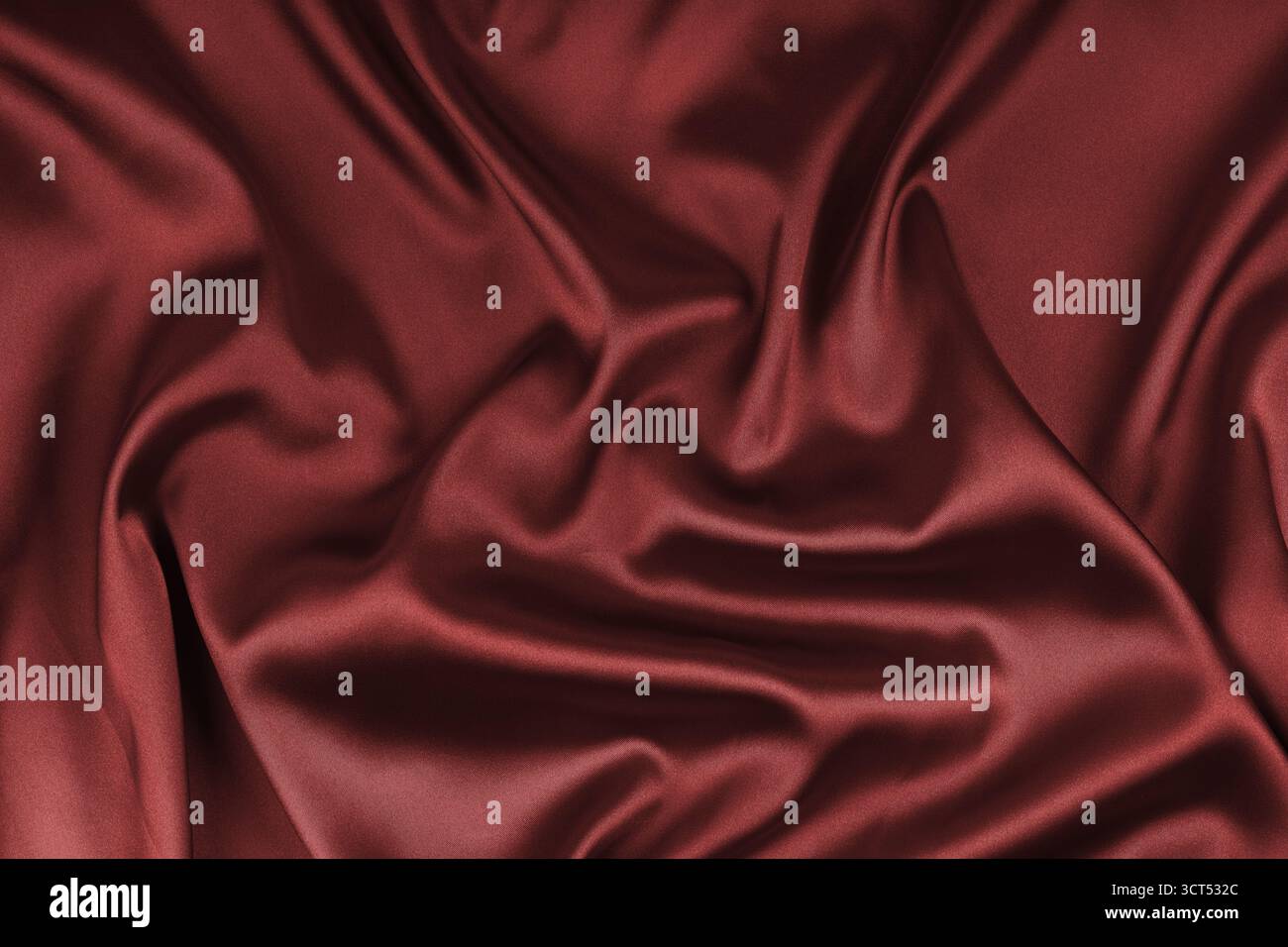 Crumpled, wrinkled maroon colored glossy silk satin texture. Shiny ...