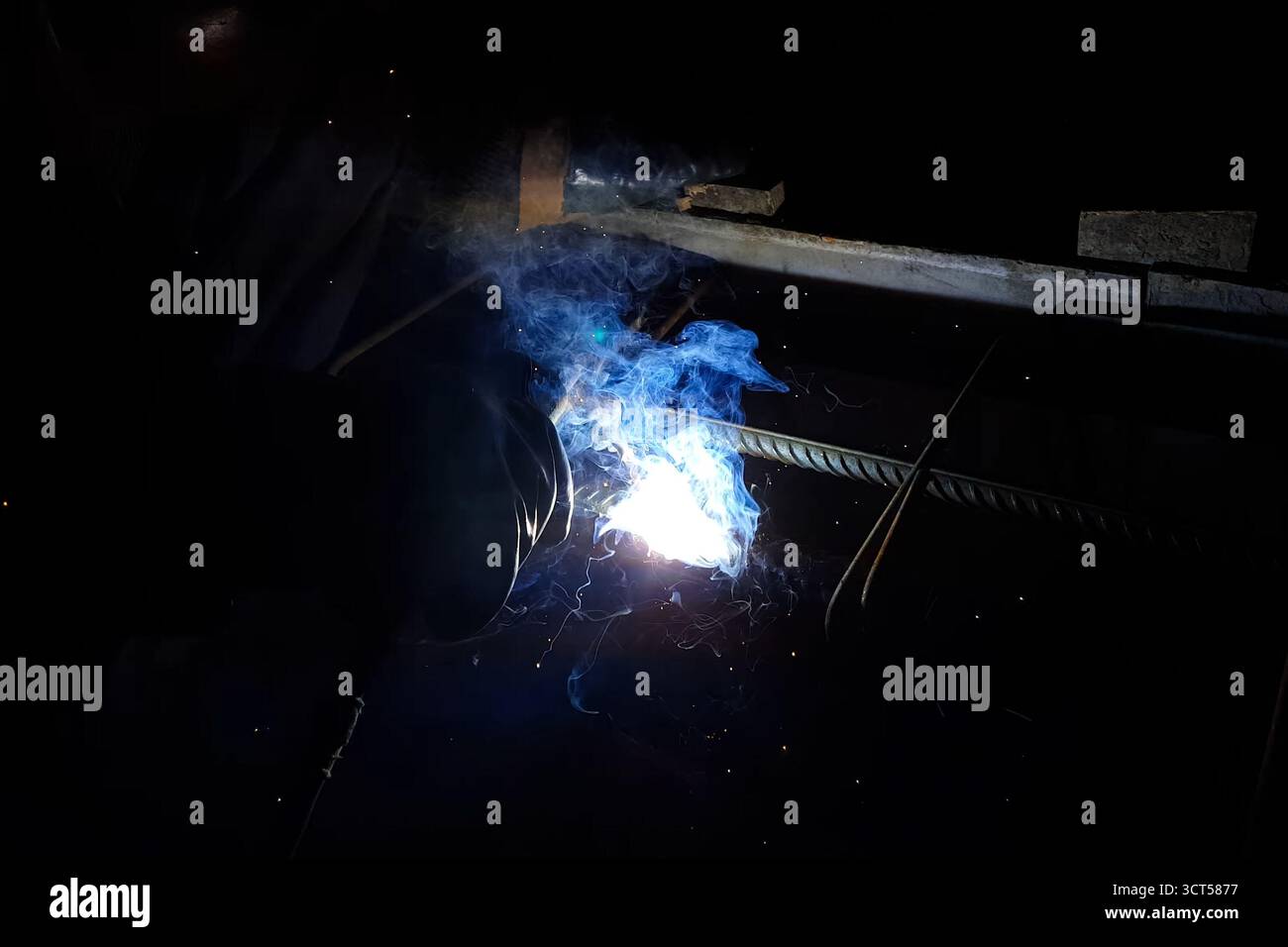 Welding of steel reinforcement. Sparks and light from welding. Electric ...